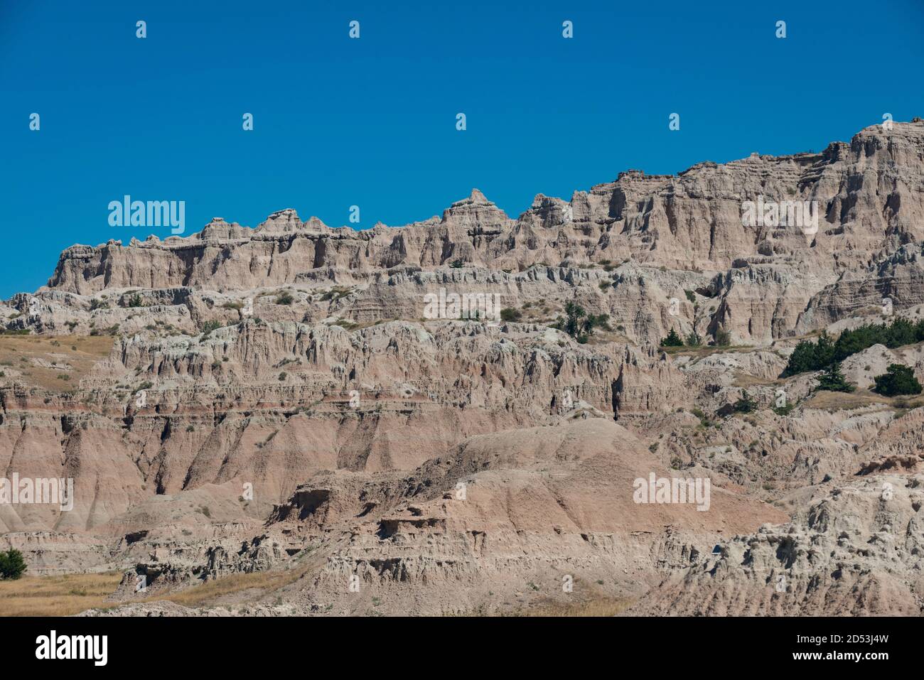 Layered Rock formations, steep Canyons and towering Spires of Badlands ...