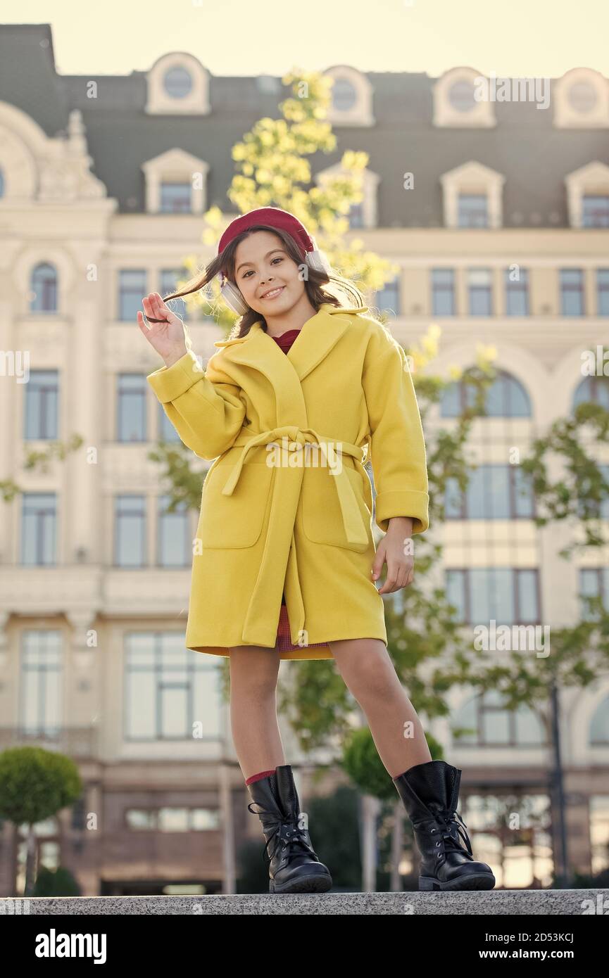Stereo sound. Child girl autumn outfit enjoying music. Little girl ...