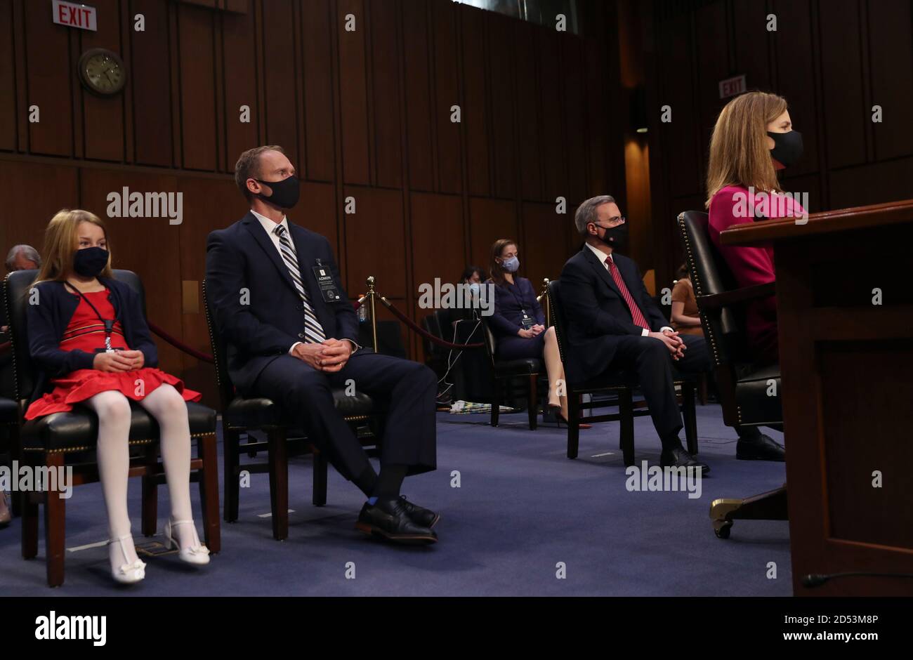 Judge Amy Coney Barrett's youngest daughter Juliet sits with her father ...