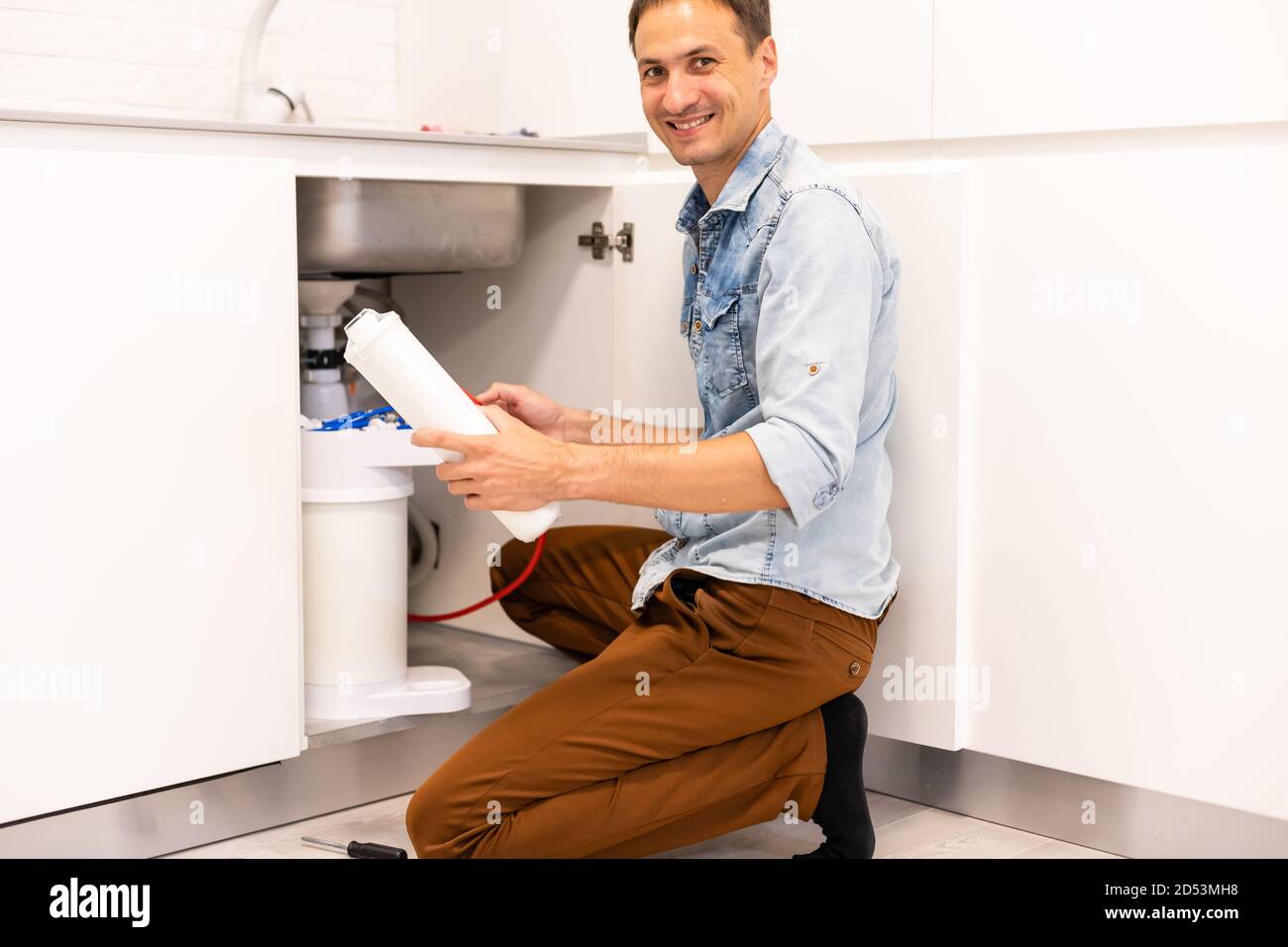 Installation of reverse osmosis water purification system Stock Photo ...