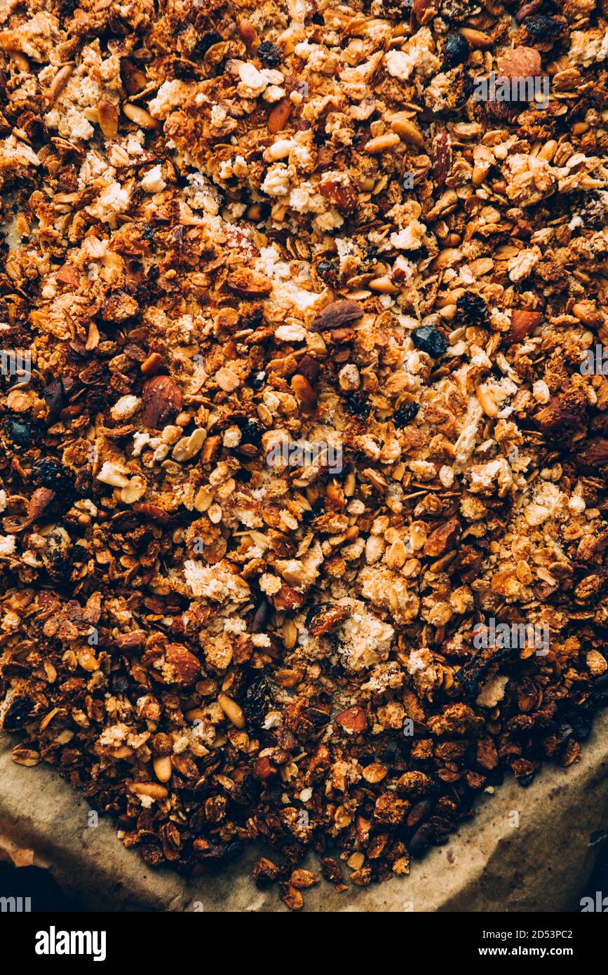Handmade granola over a blak background. Chocolate ganache and a muffin ...