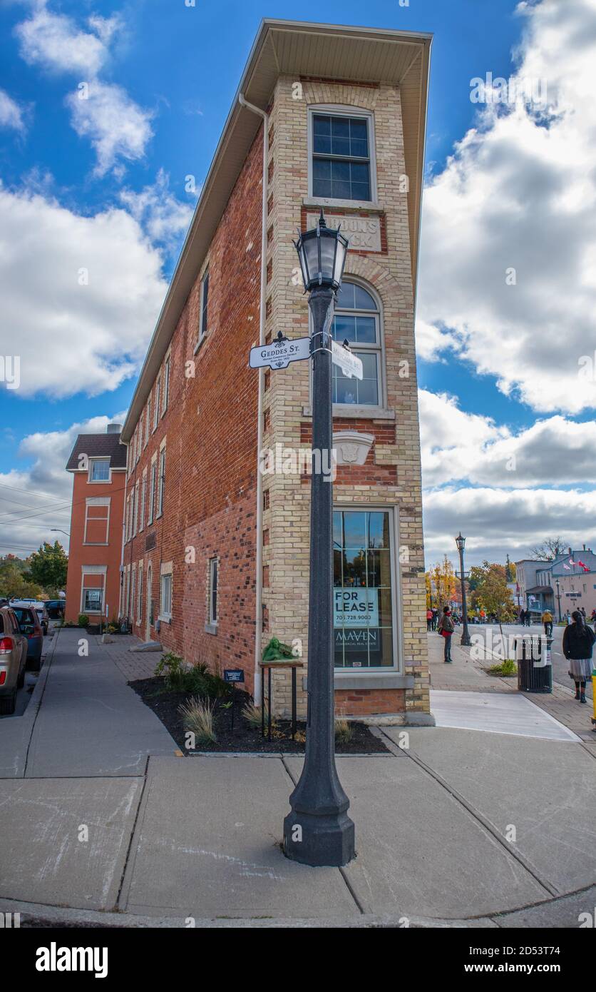 A very narrow building that makes the corner of streets that meet Stock ...