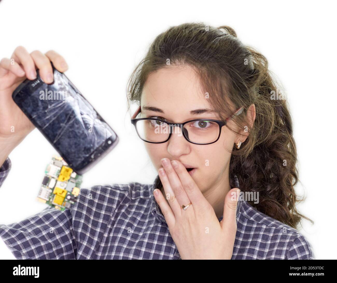 the young girl smashed the phone in surprise Stock Photo - Alamy