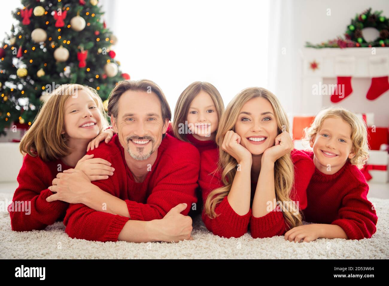 Photo of full big family five people meeting three little kids cuddle ...