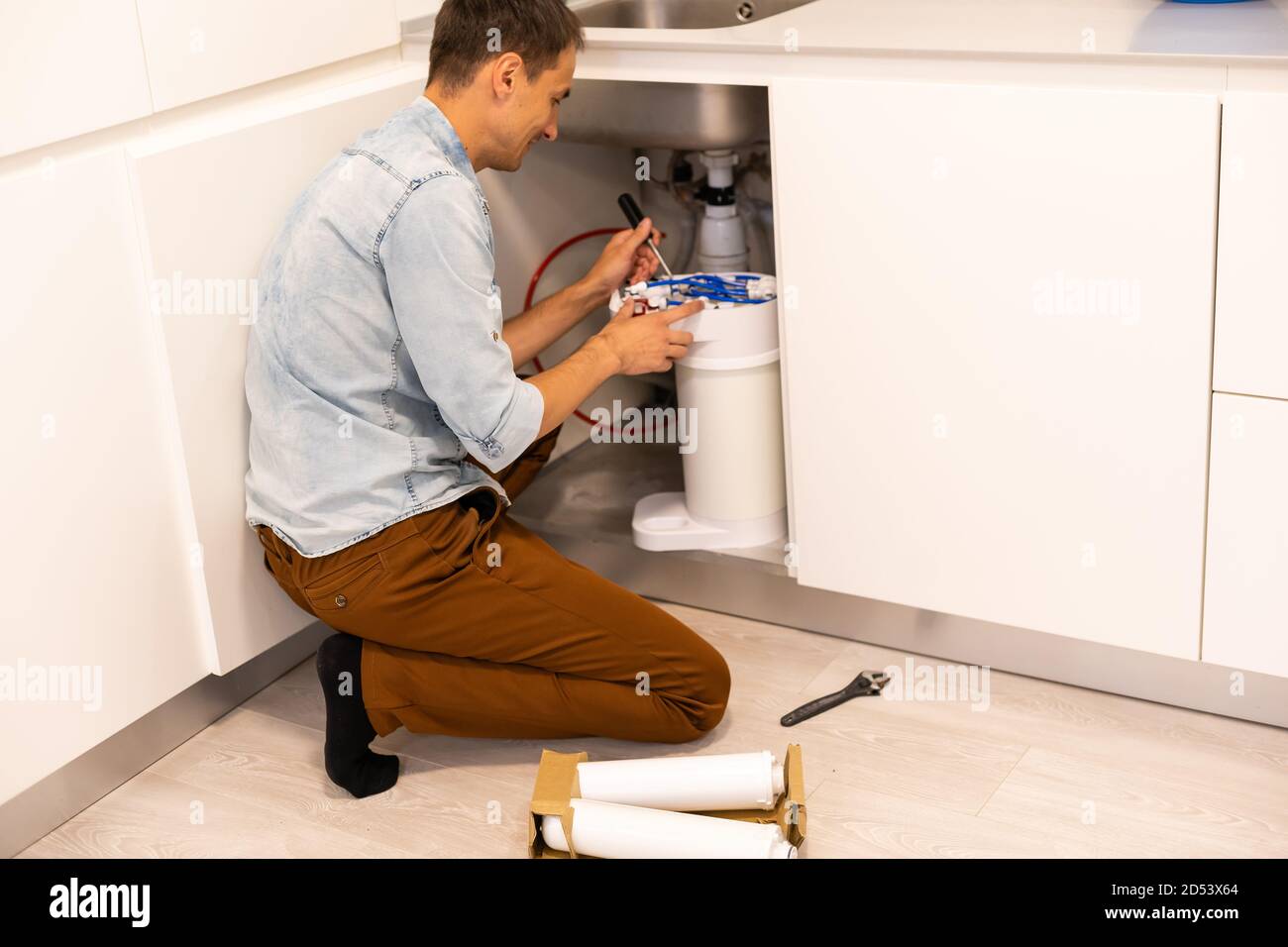 Installation of reverse osmosis water purification system Stock Photo ...