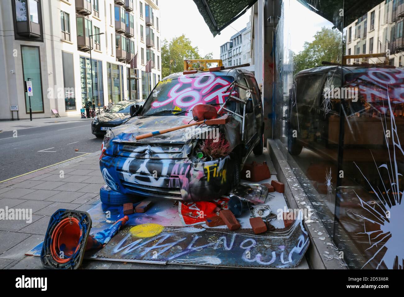 London, UK. 07 October 2020. Art installation of a wrecked car with ...
