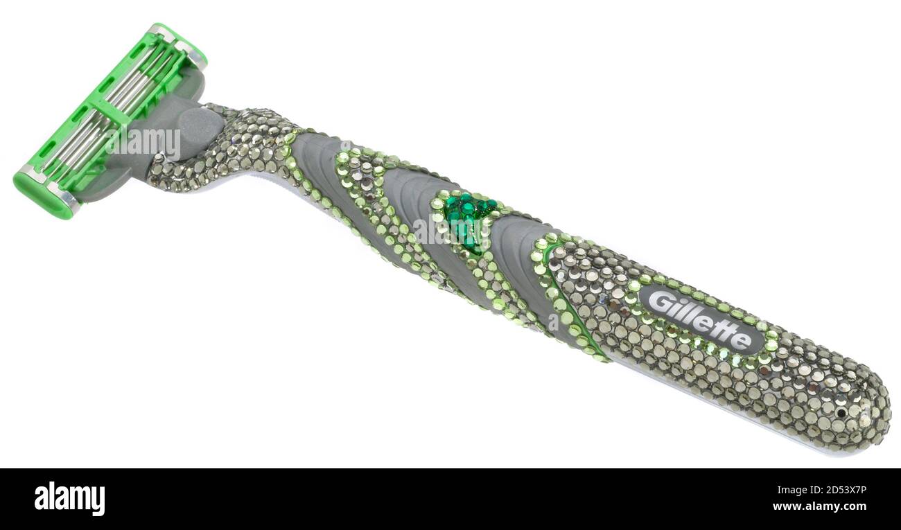 crystal Gillette razor with green and silver jewels photographed on a ...