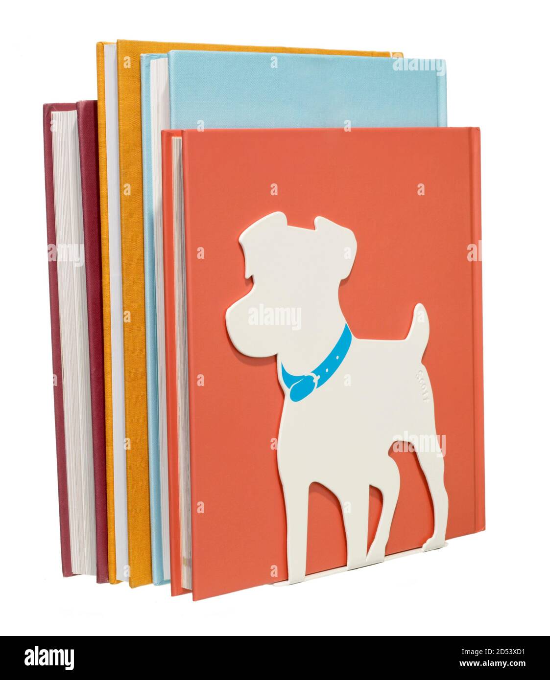 White dog-shaped bookend with books photographed on a white background ...
