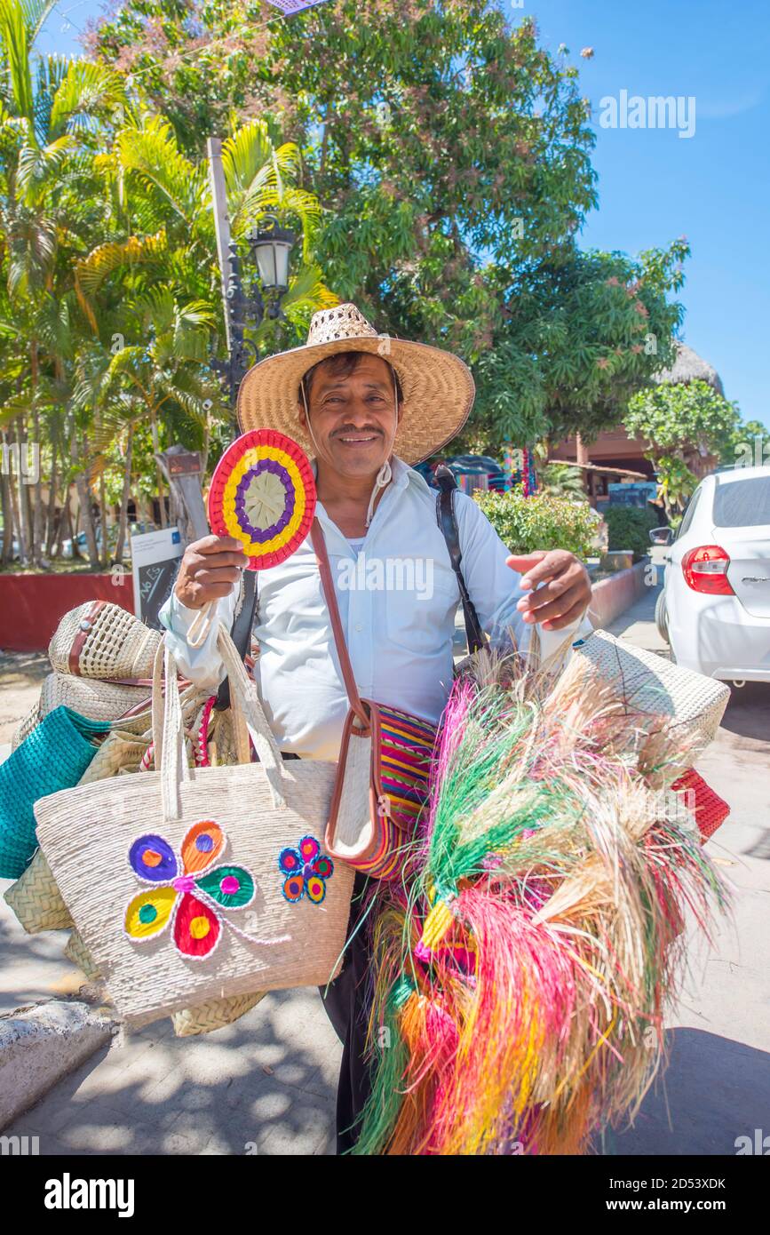 Colorful happy Mexican vendor in the streets of San Pancho, San ...