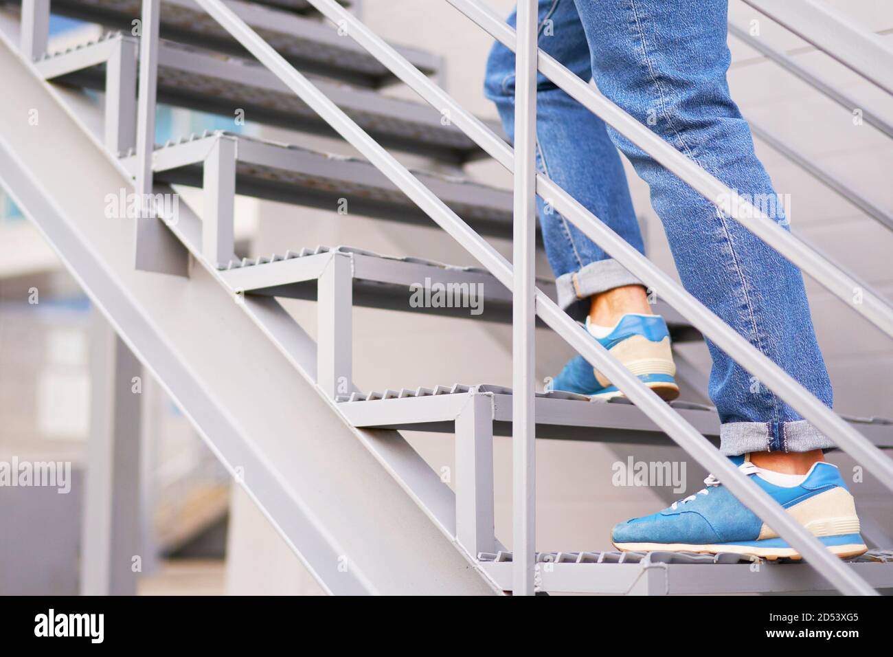person going up the ladder career concept Stock Photo - Alamy