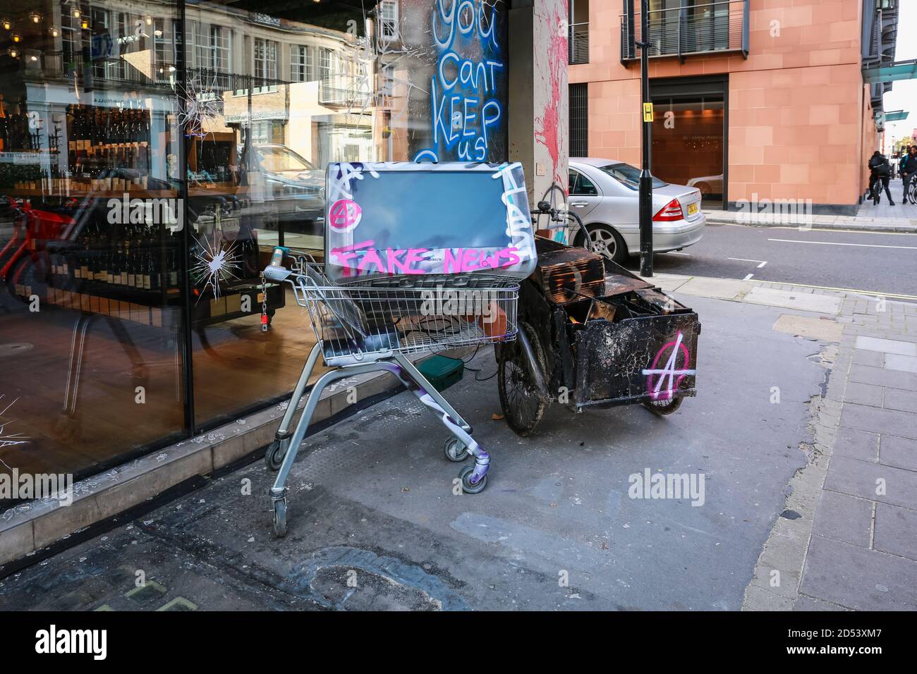 London, UK. 07 October 2020. A television on a shopping trolley with ...