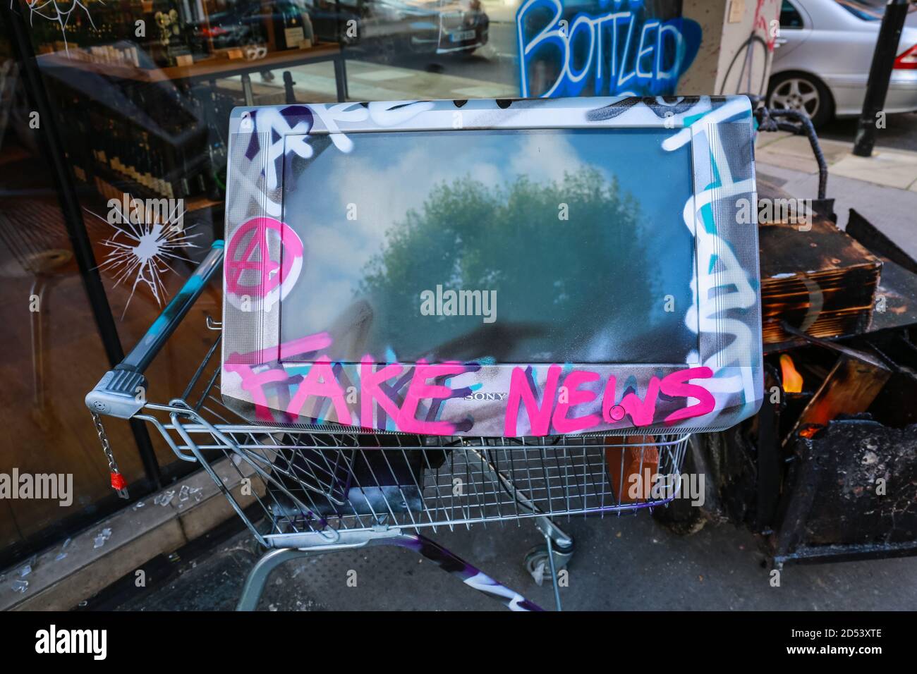 London, UK. 07 October 2020. 'Fake News' a television on a shopping ...