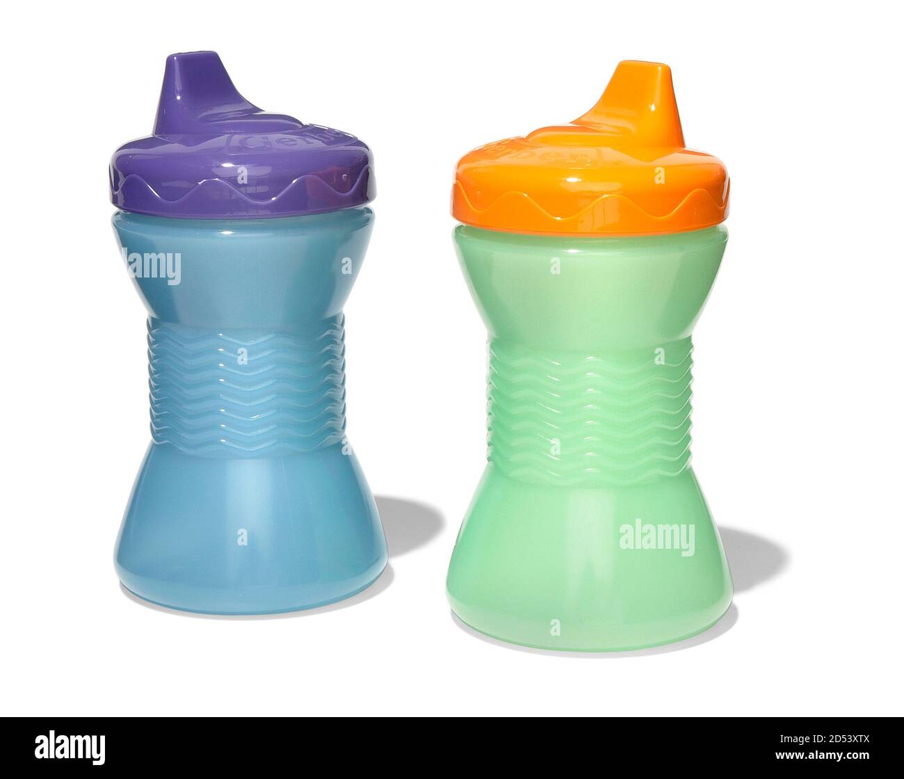 two colorful plastic Gerber Baby sippy cups photographed on a white ...