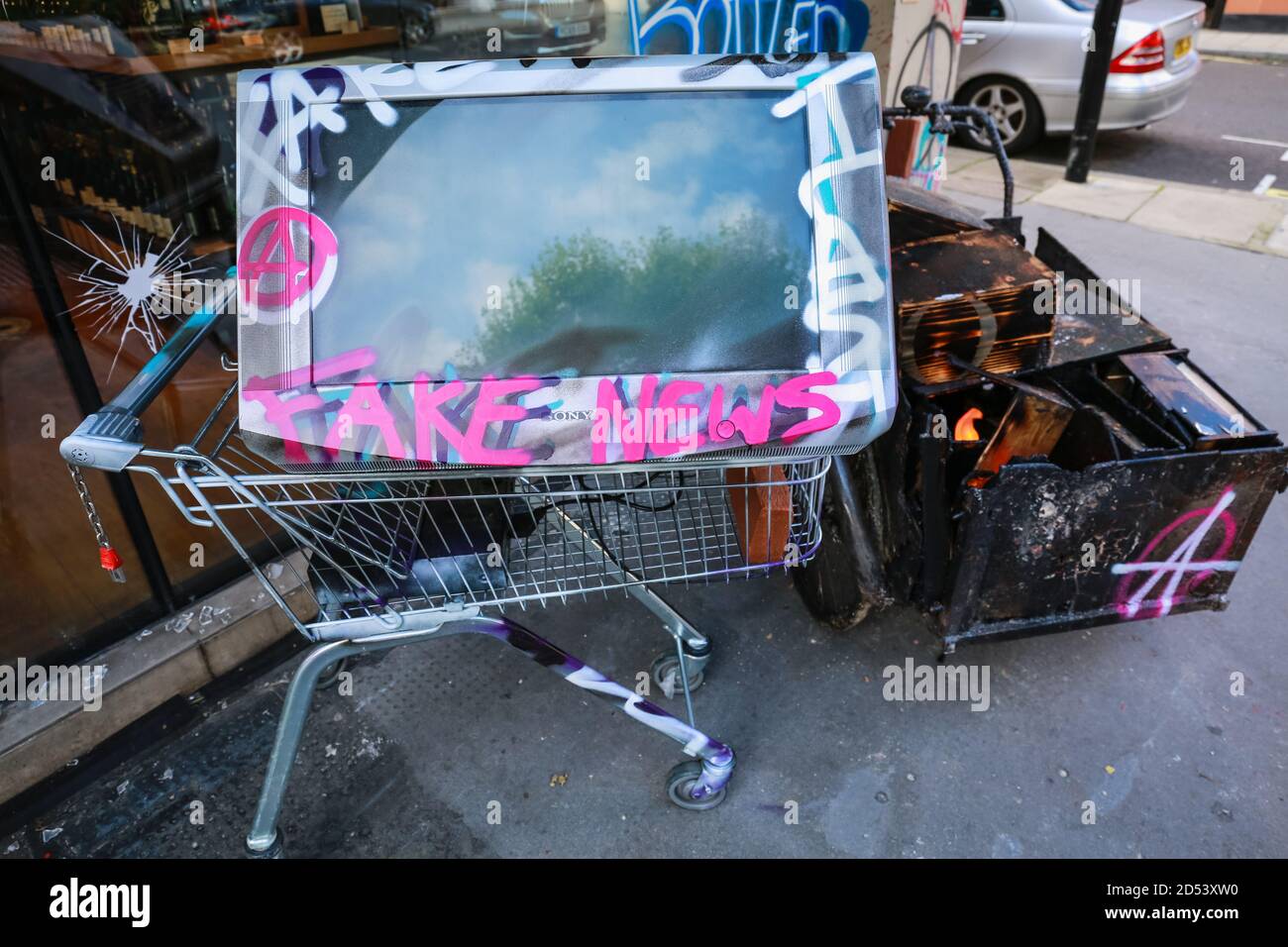 London, UK. 07 October 2020. A television on a shopping trolley with ...