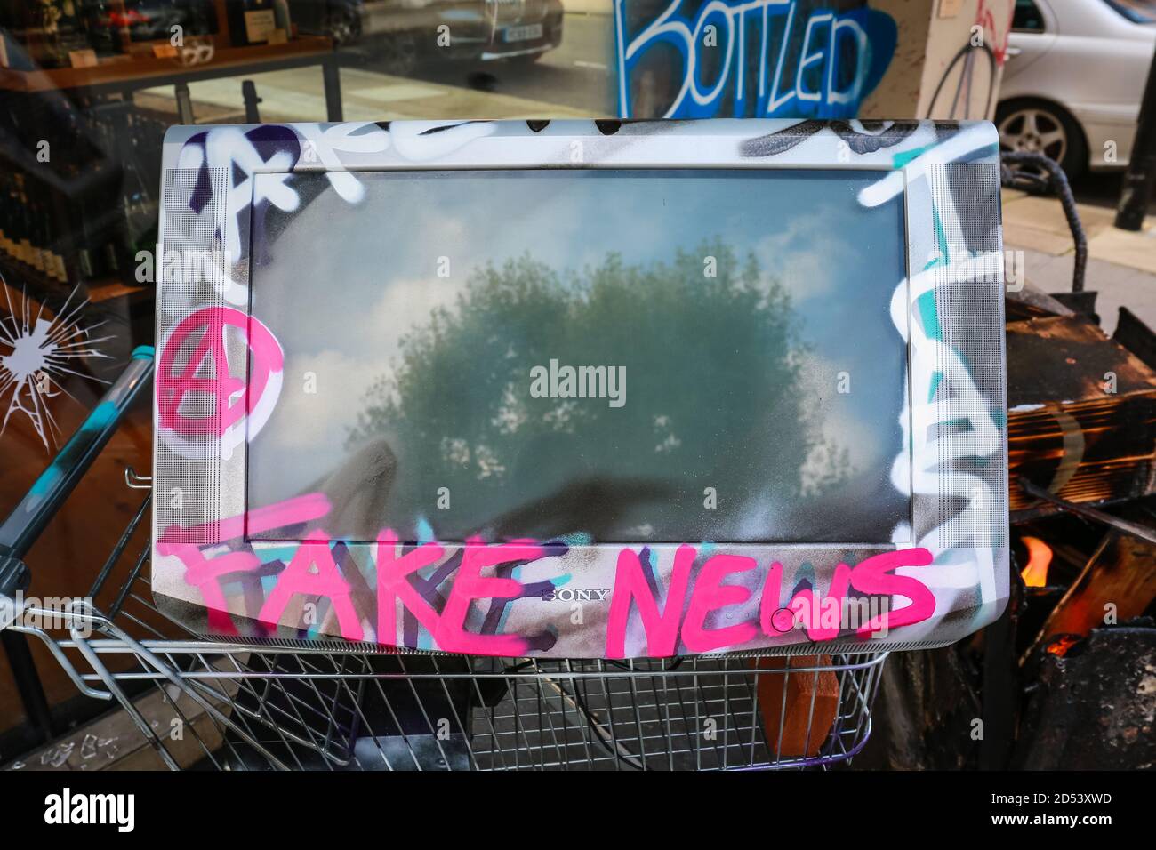 London, UK. 07 October 2020. 'Fake News' a television on a shopping ...