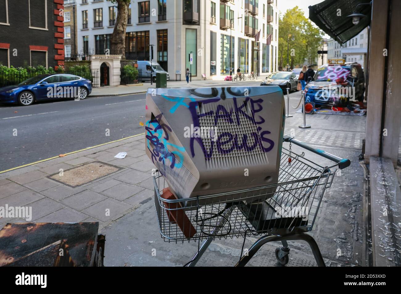 London, UK. 07 October 2020. A television on a shopping trolley with ...