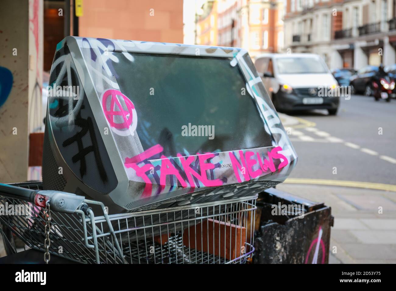 London, UK. 07 October 2020. A television on a shopping trolley with ...