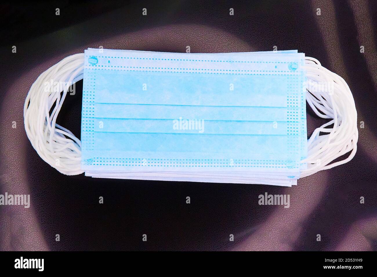 medical blue masks on black textured background Stock Photo - Alamy