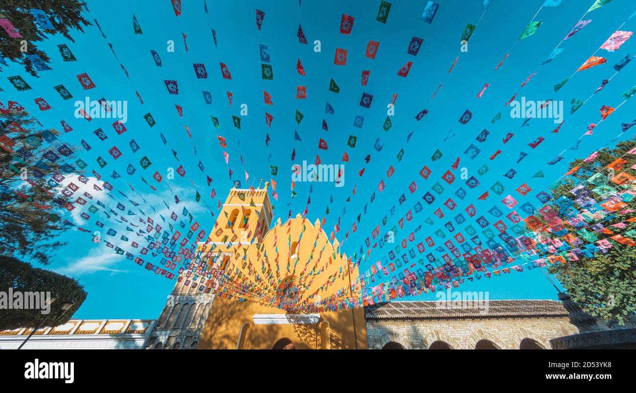 Low angle shot of the colorful pennants in front of the Saint Dominic's ...