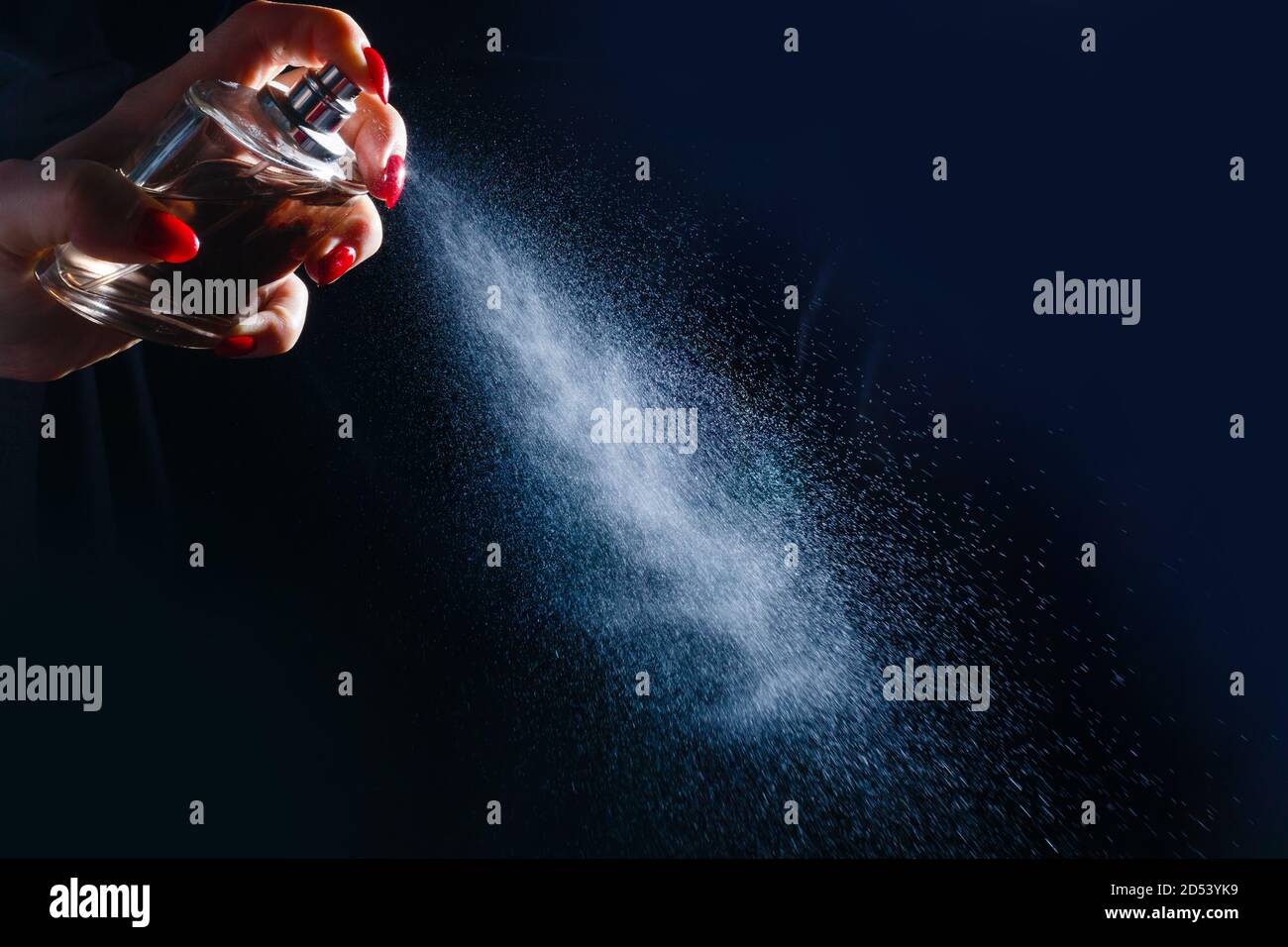 Hand of lady that applying alcohol spray or anti bacteria spray to ...