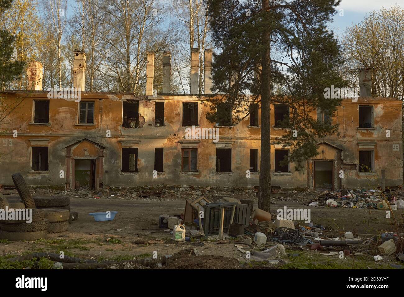 scary abandoned building with dark Windows at sunset Stock Photo - Alamy