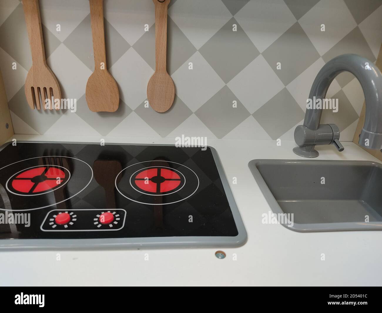 Closeup shot of toy kitchen utensils set up on a kiddy indoor ...