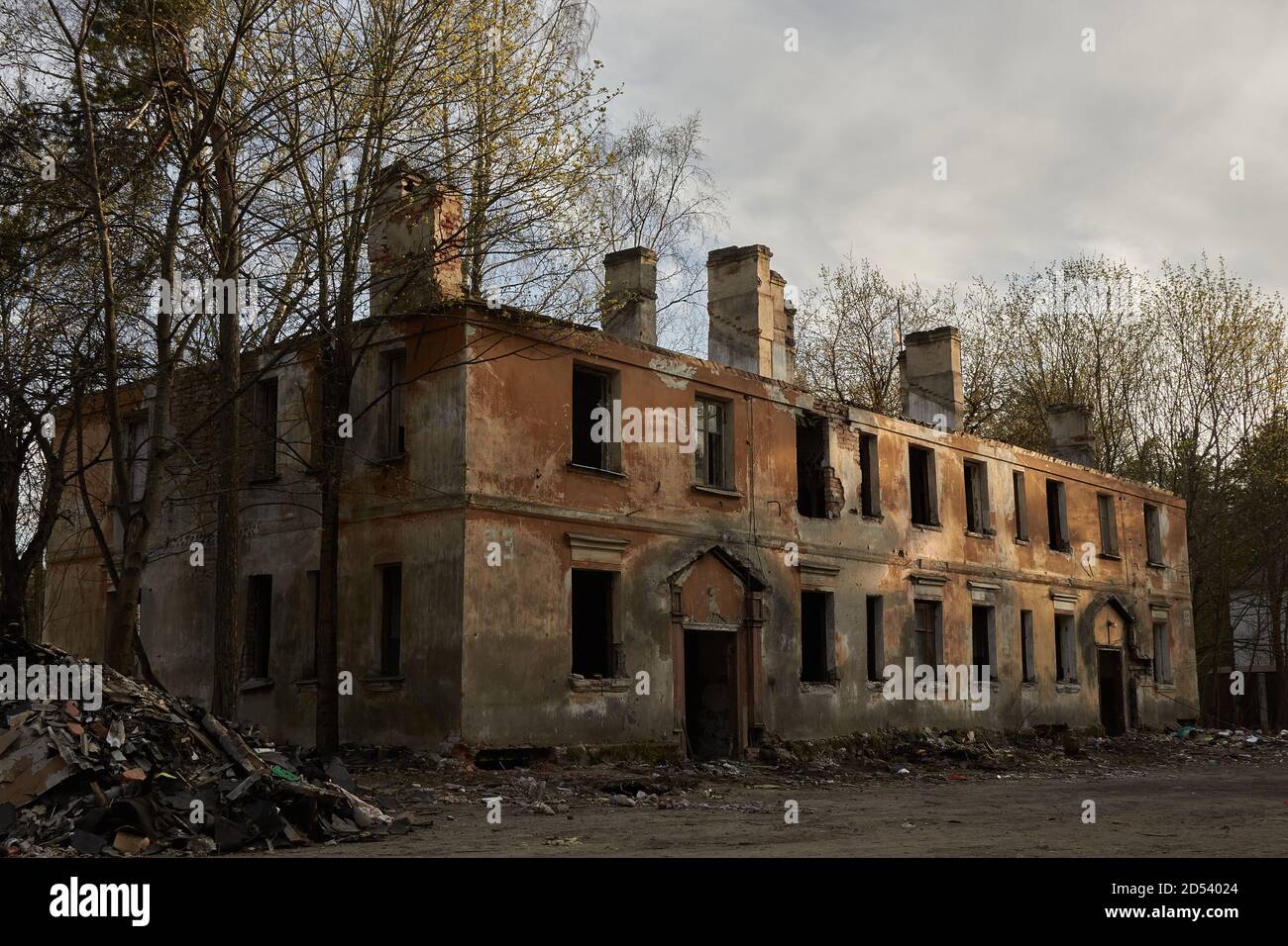 scary abandoned building with dark Windows at sunset Stock Photo - Alamy
