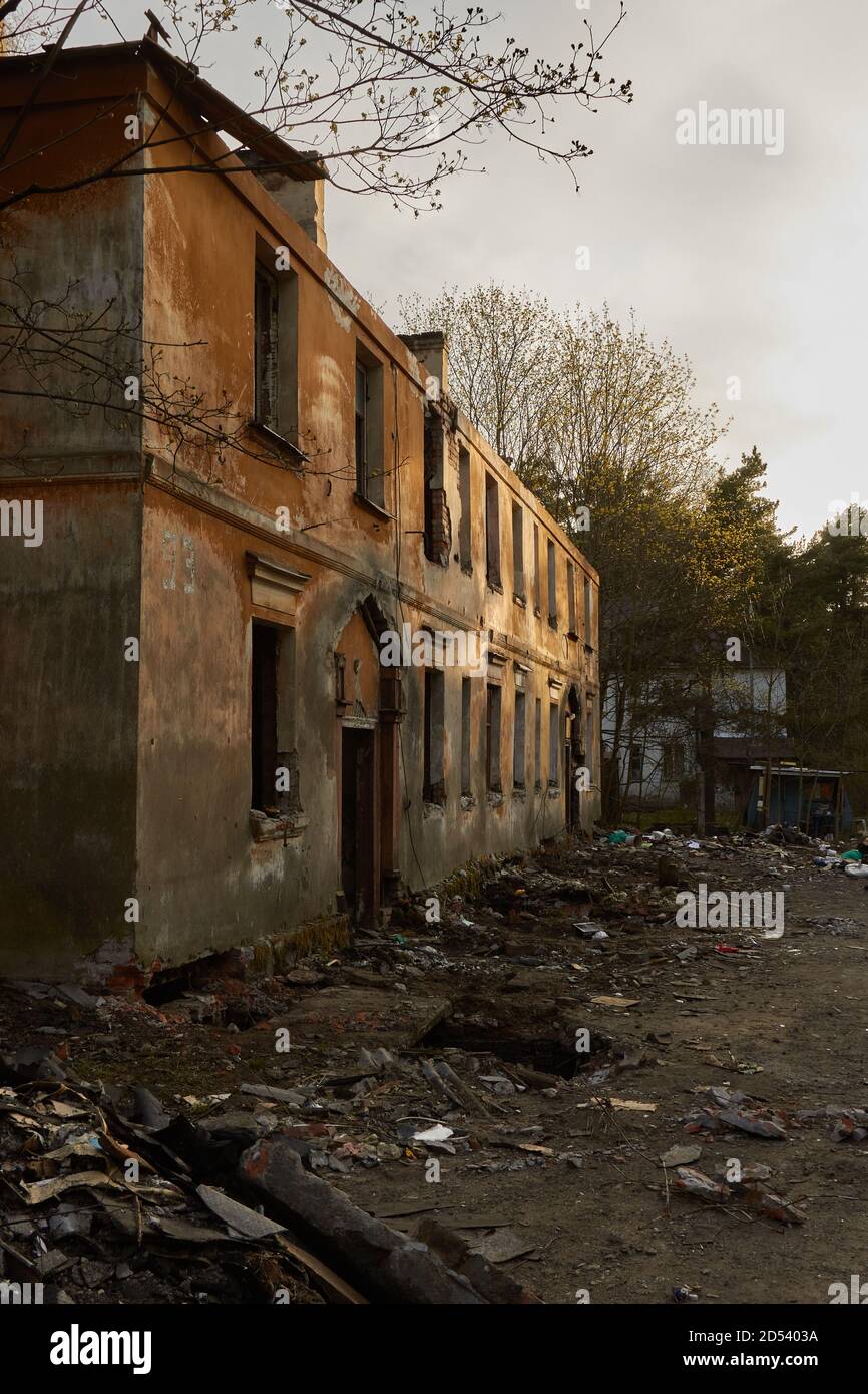 scary abandoned building with dark Windows at sunset Stock Photo - Alamy