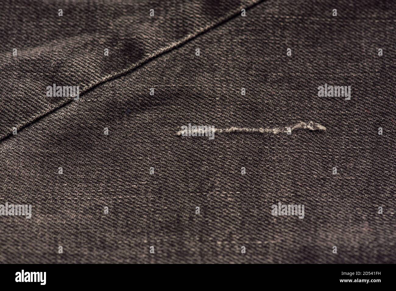 black Denim fabric texture. Black jeans denim cloth fragment as a ...