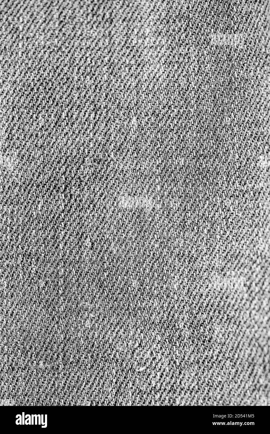 black Denim fabric texture. Black jeans denim cloth fragment as a ...