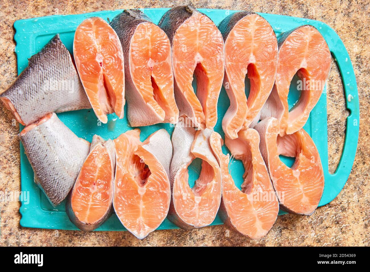 French fresh fish cut and spread on cutting board Stock Photo - Alamy