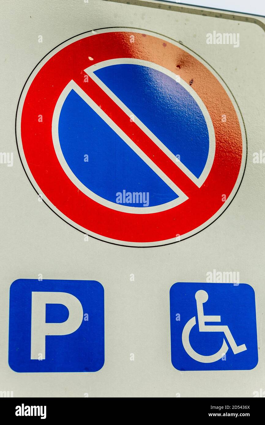 weathered no parking road sign Stock Photo - Alamy