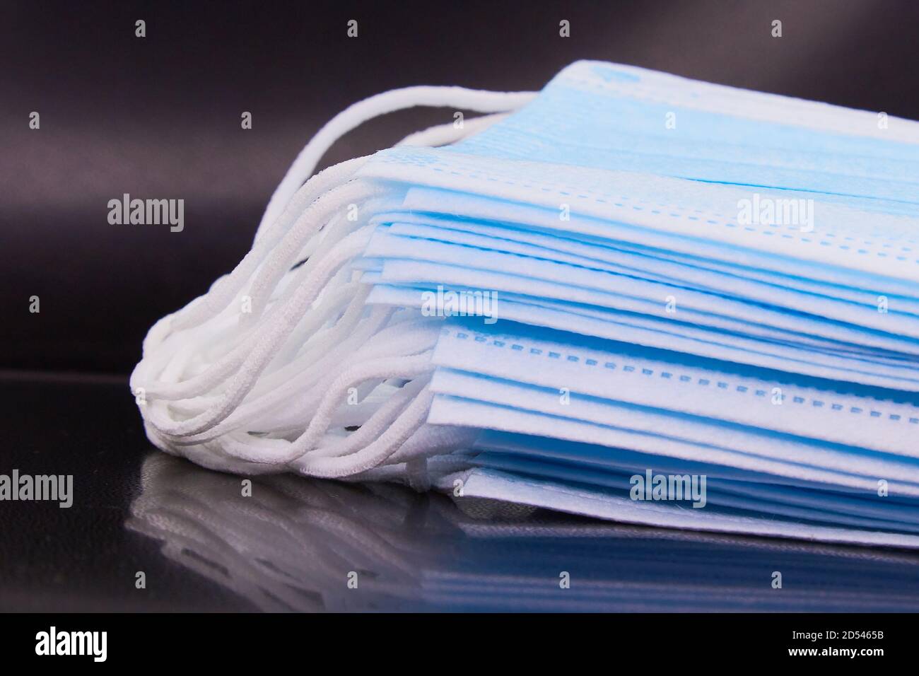medical blue masks on black textured background Stock Photo - Alamy