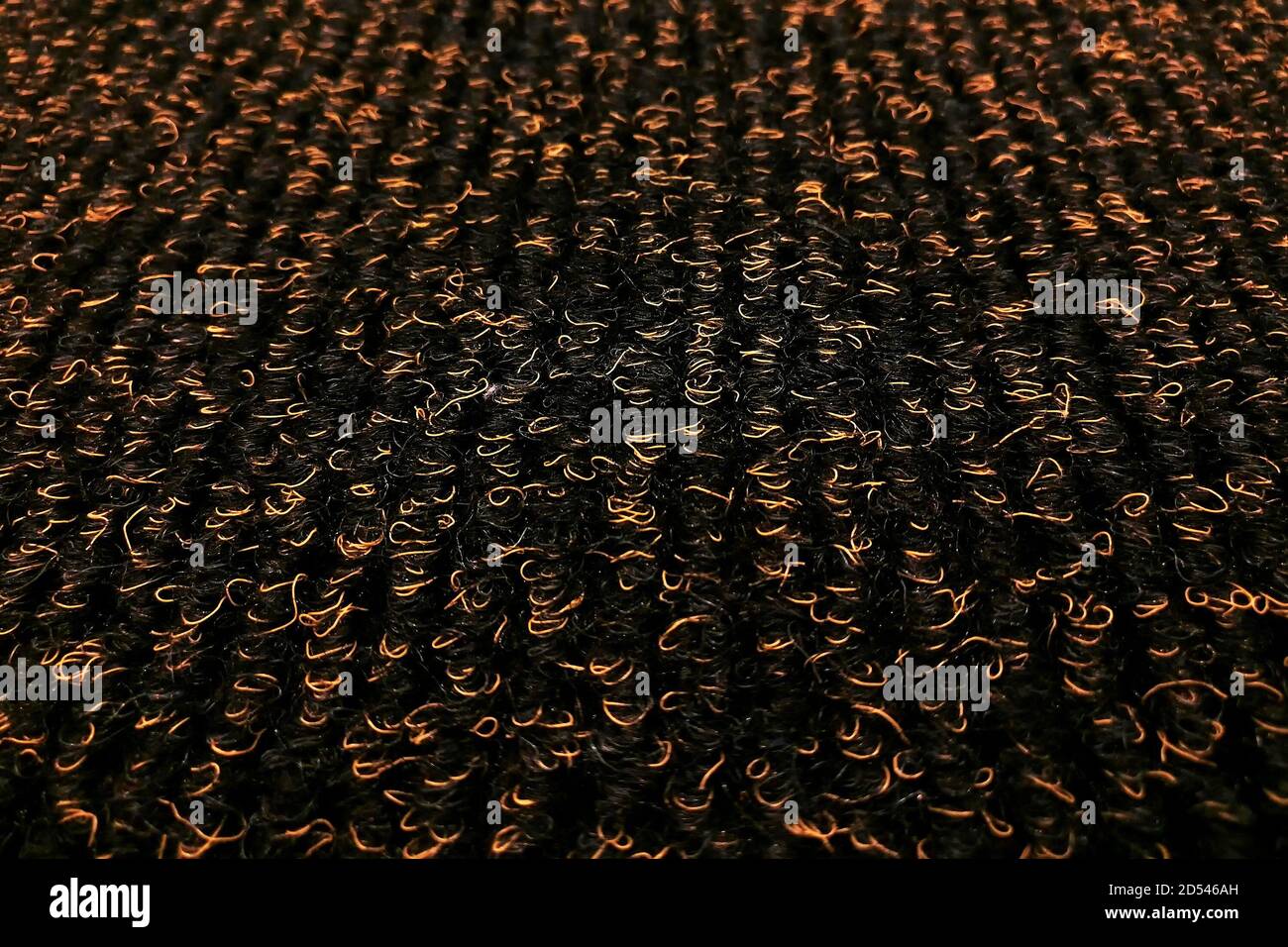 Black carpet background with orange villus, texture close-up Stock ...