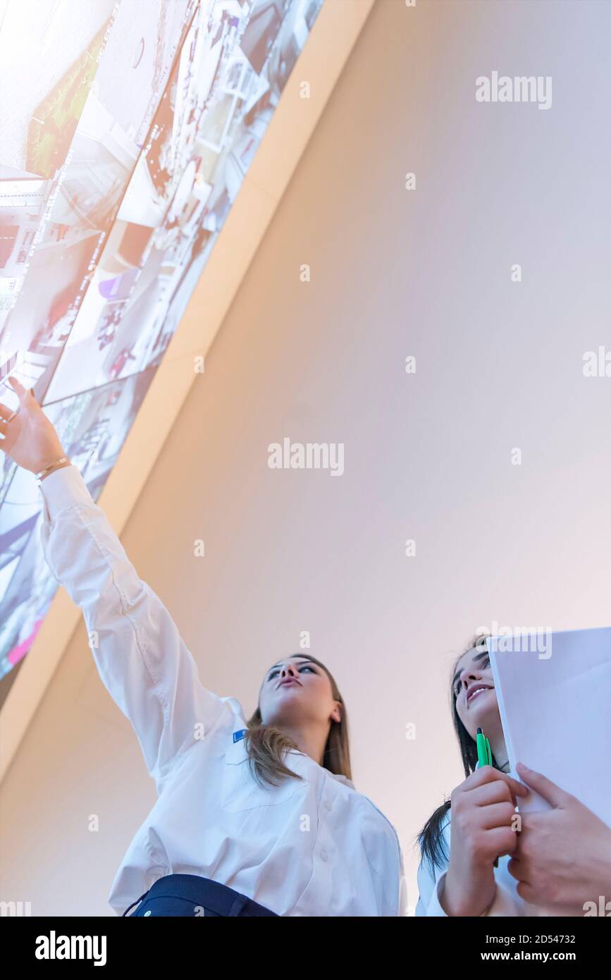 Security Guard Monitoring Modern Cctv Cameras In A Surveillance Room
