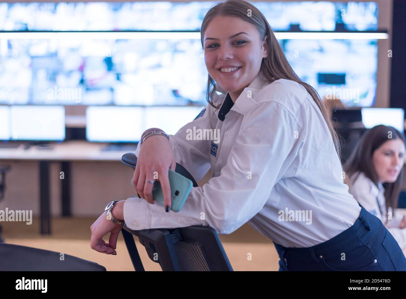 Security guard monitoring modern CCTV cameras in surveillance room ...