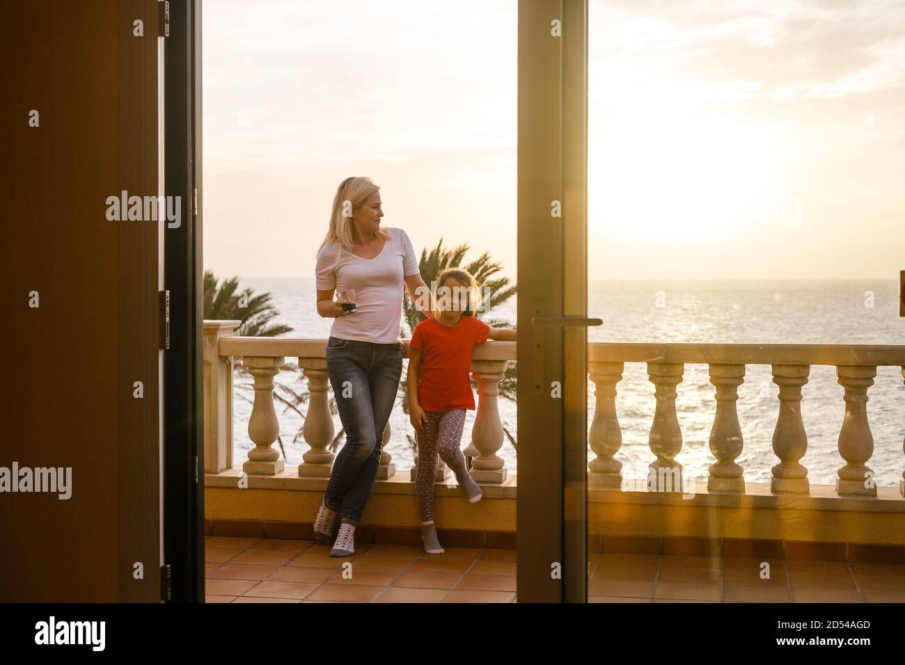 Woman near window facing the sunrise at morning Stock Photo - Alamy