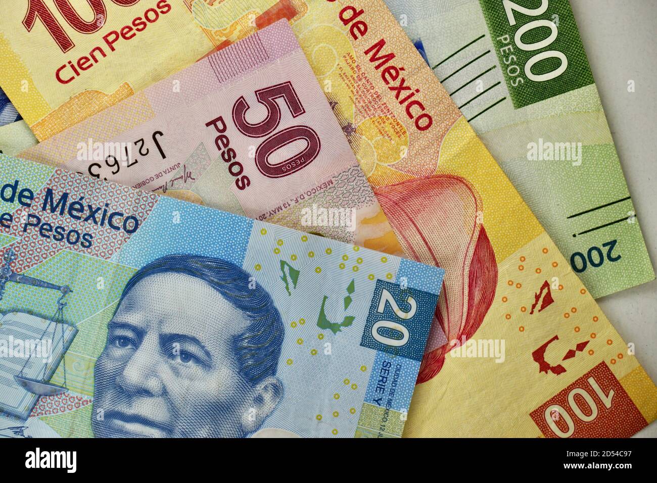 Many mexican pesos bills spread randomly over a flat surface Stock ...