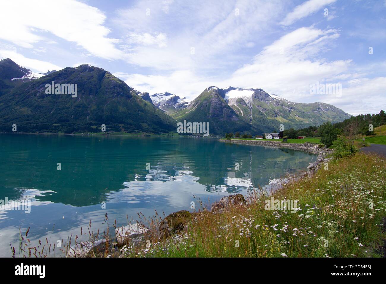 Tranquil view of a lake surrounded by greenery in a Norway Stock Photo ...