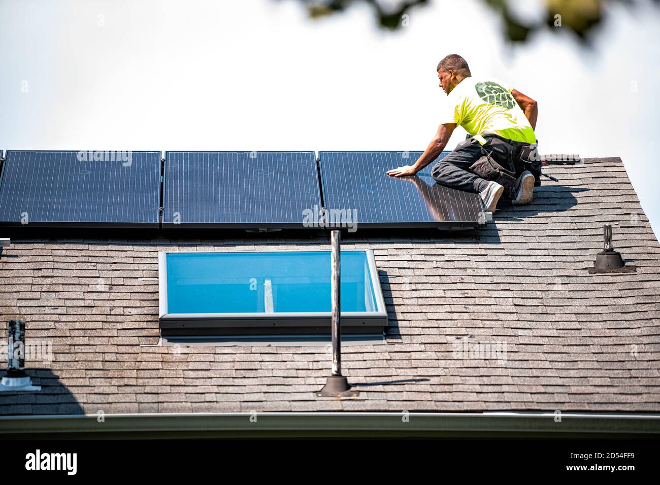 Herndon, USA - August 27, 2020: Person man worker installing rooftop ...
