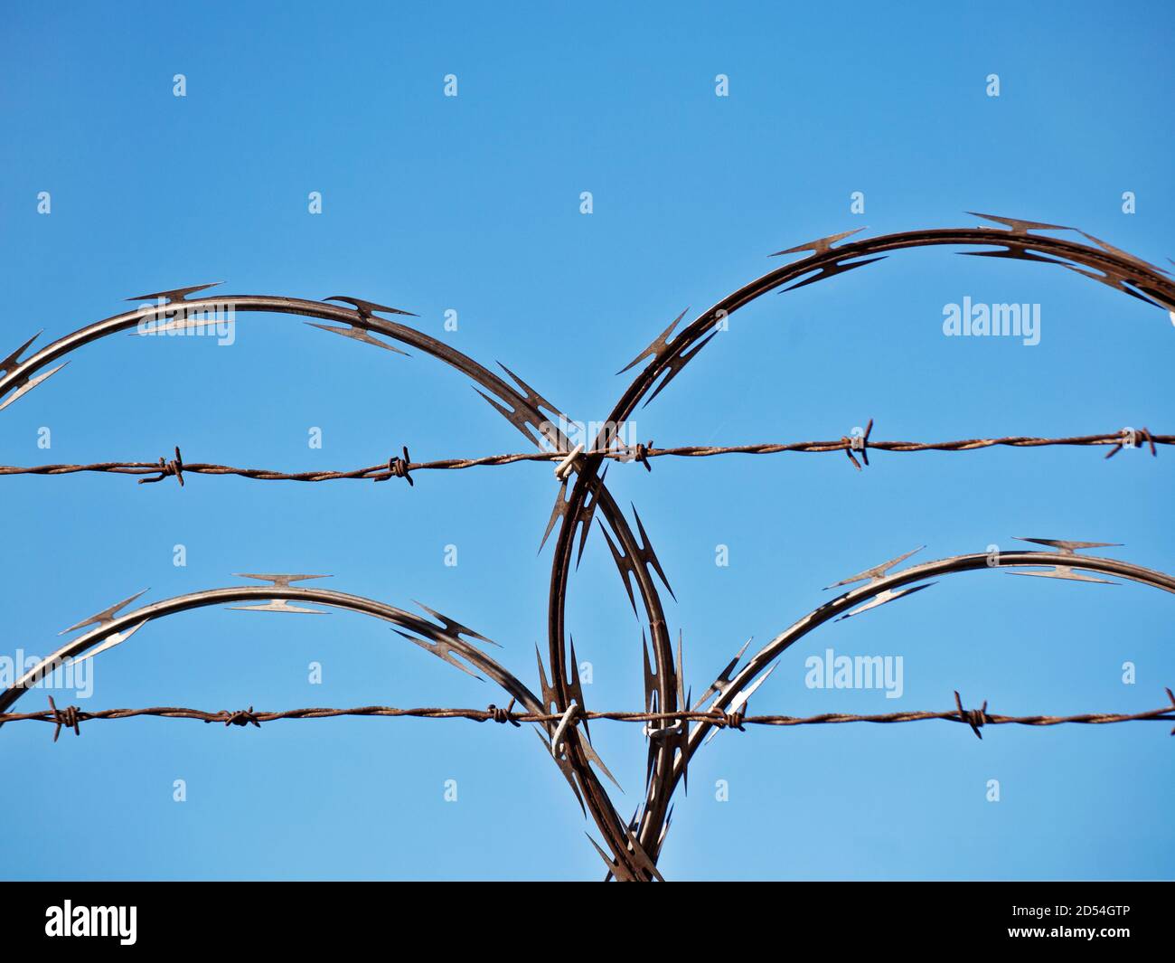 Razor wire metal mesh fence hi-res stock photography and images - Alamy