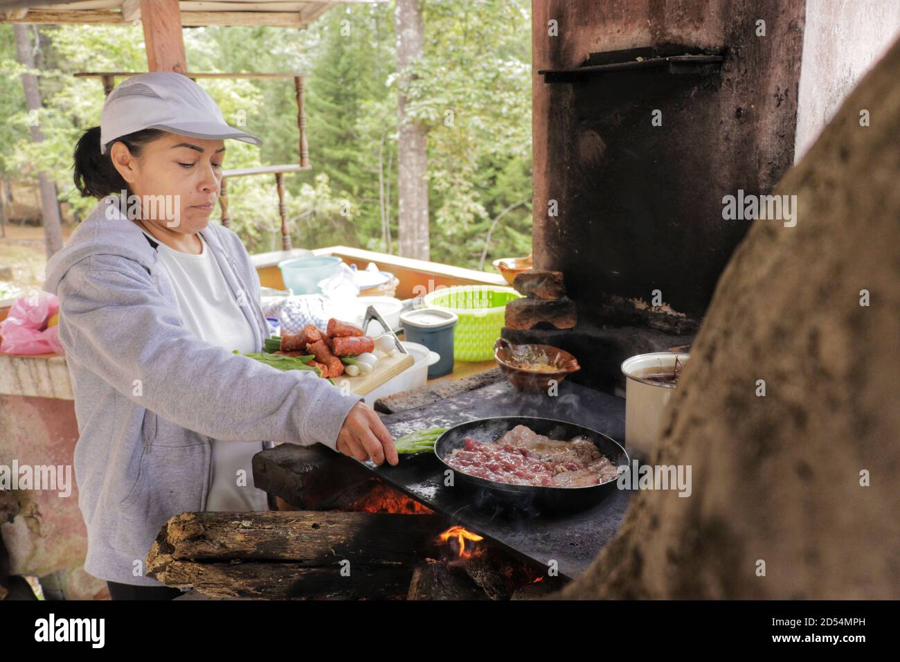 Old Woman Cooking Outside House High Resolution Stock Photography and ...