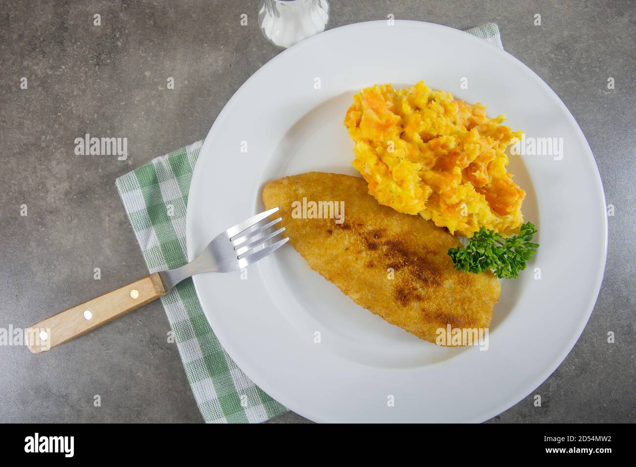 plate of breaded fish and carrot puree Stock Photo - Alamy