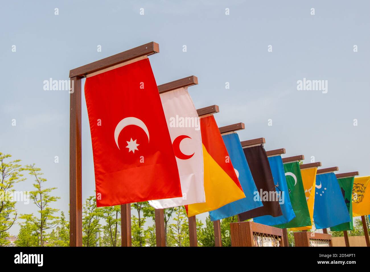 Closeup of different flags of Islamic countries on flagpoles under a ...