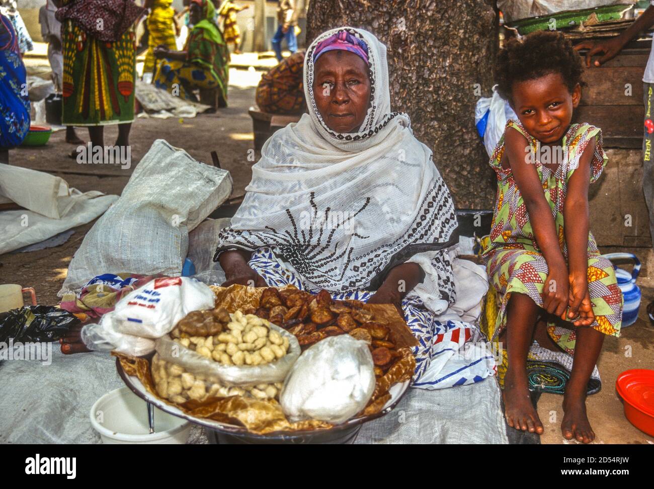 Abidjan, Ivory Coast, Cote d'Ivoire. Old Woman and Granddaughter ...
