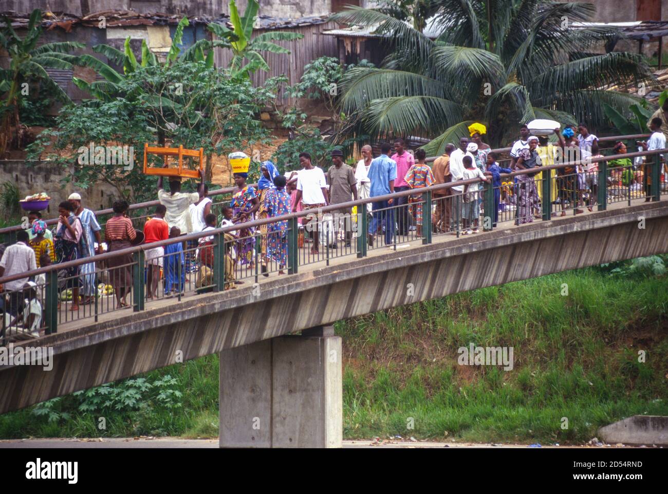 Abidjan, Ivory Coast, Cote d'Ivoire. Ivorians on Pedestrian Bridge En ...