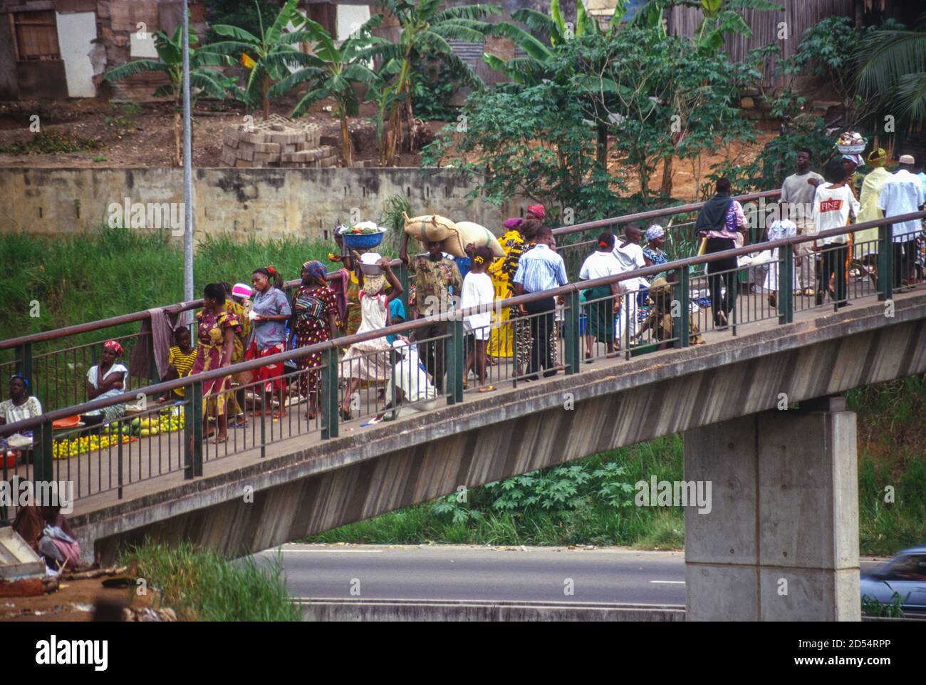 Abidjan, Ivory Coast, Cote d'Ivoire. Ivorians on Pedestrian Bridge En ...