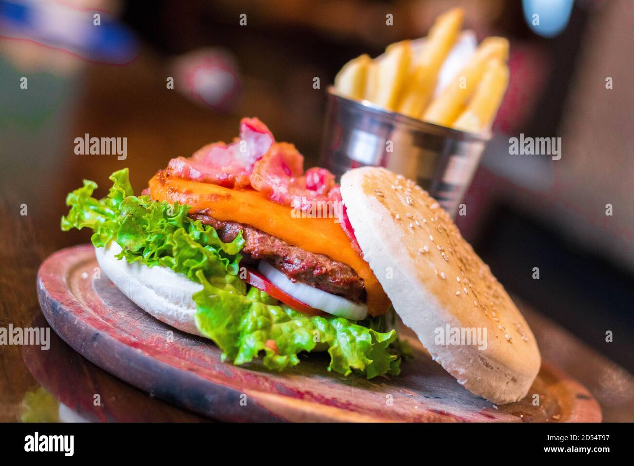 Open burger with french fries in a restaurant Stock Photo - Alamy
