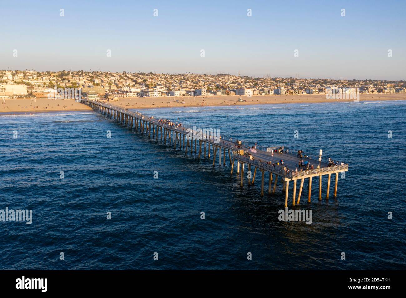 Hermosa Beach pier from the air out over the Pacific Ocean at sunset ...