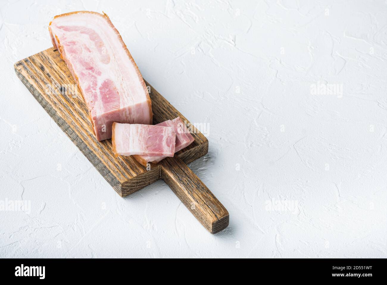 Smoked bacon, whole slab on white background with space for text Stock ...